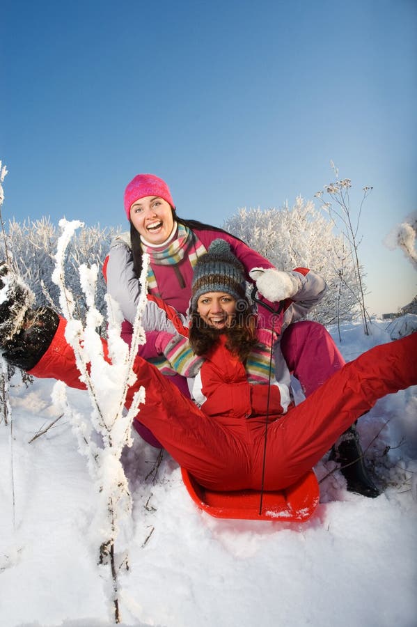 Two Beautiful Girls with Sledges Stock Photo - Image of hold, couple ...