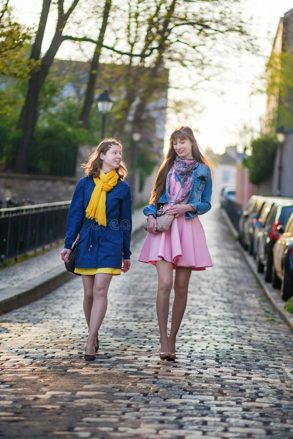 Two Beautiful Girls Walking Together and Chatting Stock Image - Image ...