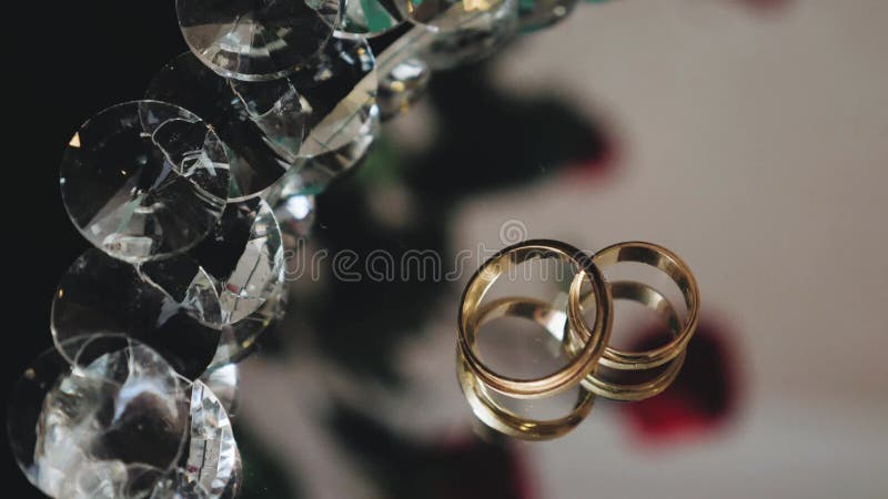 Two Beautiful Gold Rings on a Mirrored Surface. Beautiful Objects ...