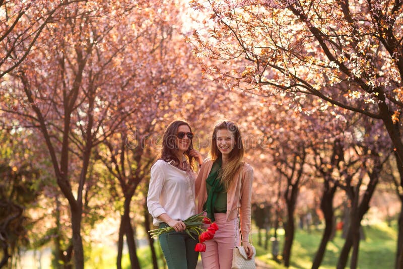 Two Beautiful Ladies in Spring Park Stock Image - Image of beautiful ...