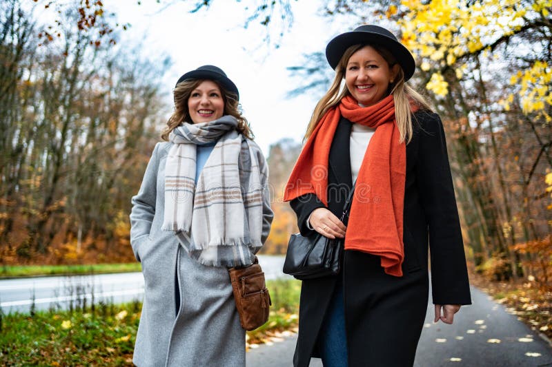 Two Beautiful Middle-aged Women on Autumn Walk. Front View Stock Image - Image of friendship ...