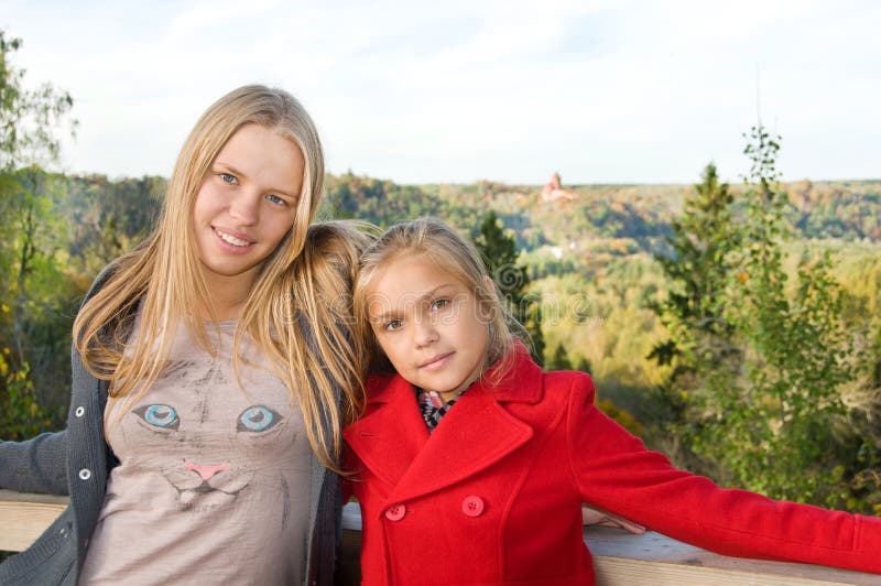 Two beautiful sisters stock image. Image of sisters, autumn - 21838475