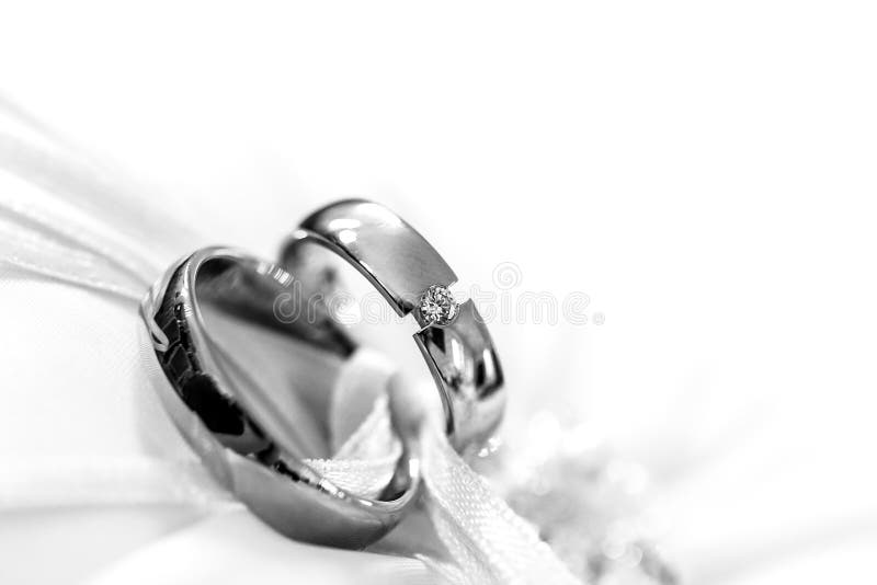 Beautiful Wedding Rings in Front of Light Background on a Cloth Stock ...