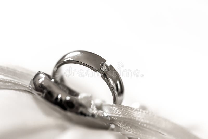 Beautiful Wedding Rings in Front of Light Background on a Cloth Stock ...