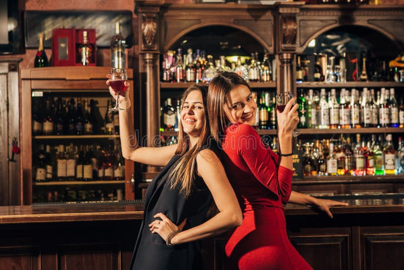 Two Beautiful Women Having Fun at the Bar Stock Photo - Image of glass ...