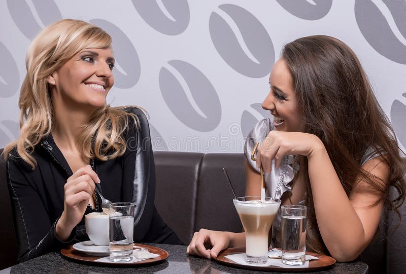 Two Beautiful Women Laughing Over a Coffee Stock Photo - Image of women ...