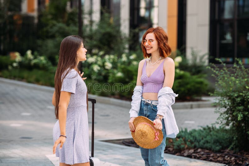 Two Beautiful Women Talking and Standing Outdoors Stock Image - Image ...