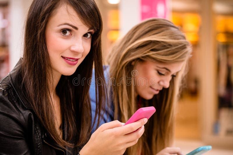 Two Beautiful Women Using Their Phone Stock Photo - Image of internet ...