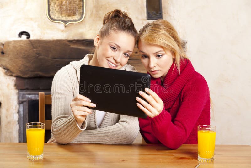 Two Beautiful Women Work on the Tablet Stock Photo - Image of touch ...