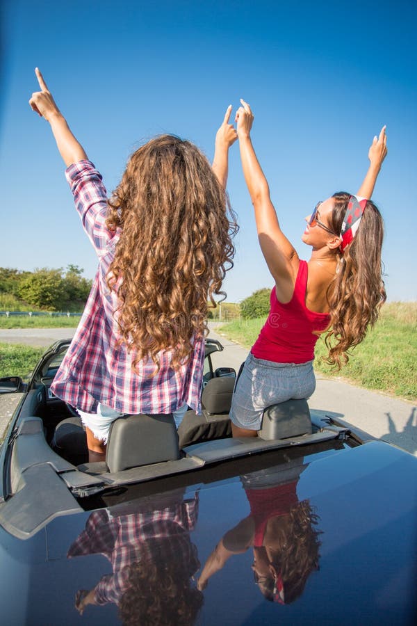 Two Beautiful Young Girls Dancing in a Convertible Stock Image - Image ...