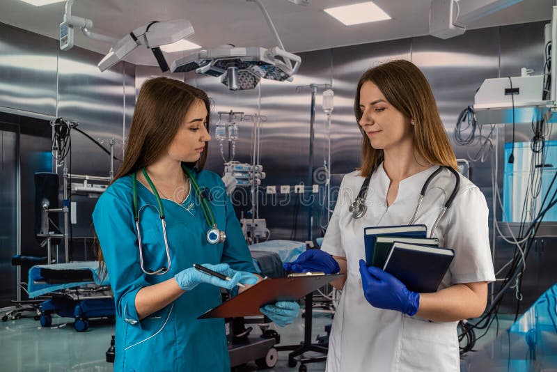 Two Beautiful Young Nurses are in the Operating Room. Stock Image ...