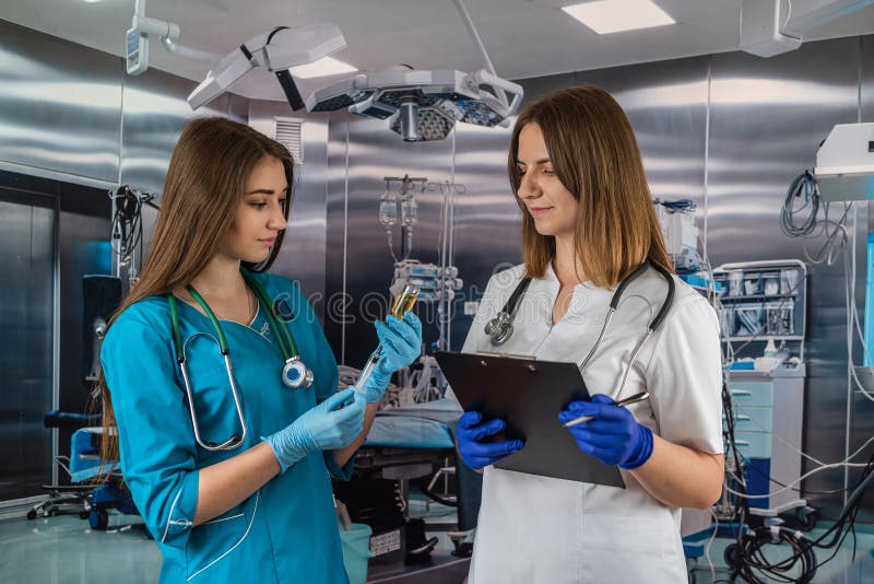 Two Beautiful Young Nurses are in the Operating Room. Stock Photo ...