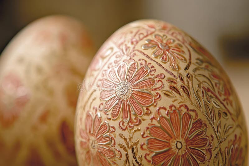 Two Beautifully Designed Easter Eggs Rest on a Table, Symbolizing the ...