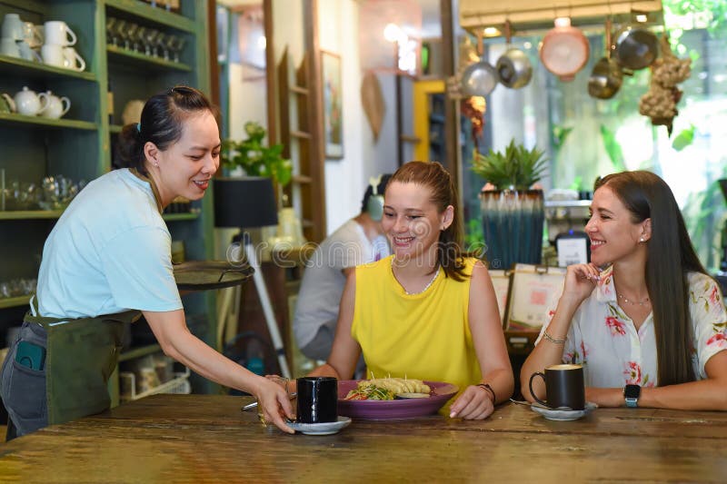 Two Best Friends Talking and Eating in a Cafe Stock Photo - Image of ...
