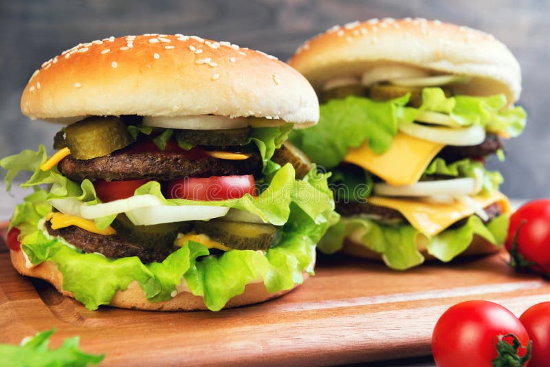 Two Big Cheeseburger Deluxe Stock Image - Image of classic, meat: 66378959