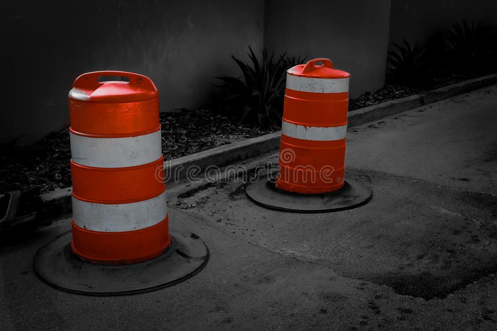 Two Big Construction Barrels with Orange and White Stripes with ...