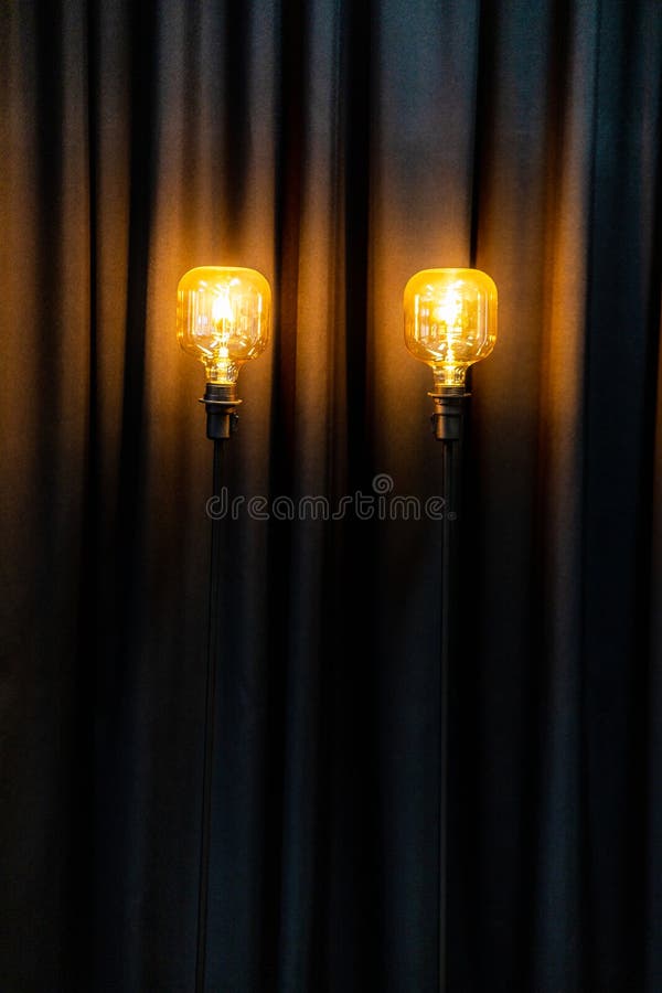 Two Big Decorative Bulbs with Golden Warm Light on Long Black Pole in ...