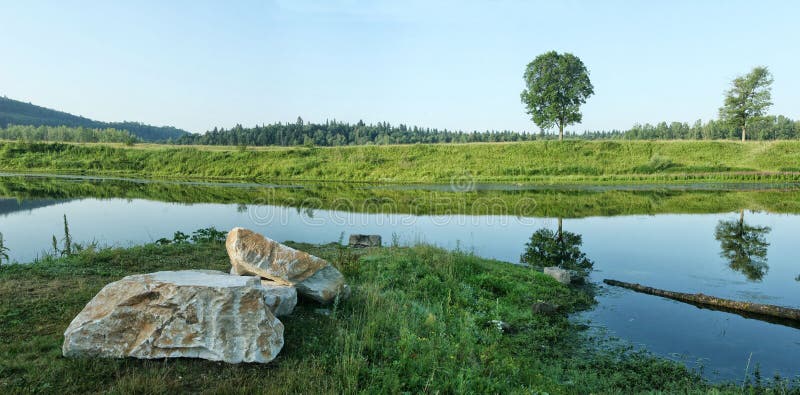 Two Big Stones on the Bank of a Quiet River Stock Photo - Image of ...