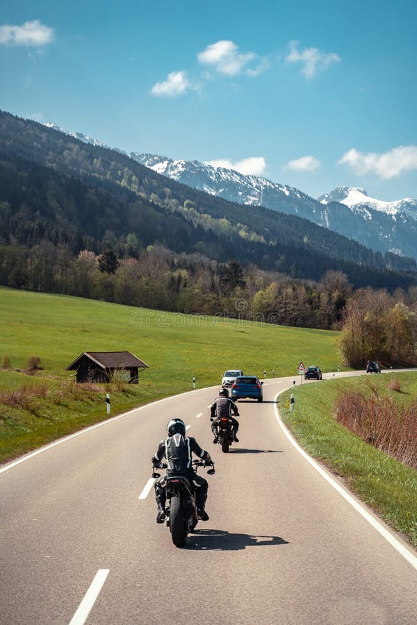 Two Biker Riding Alone on Mountainous Road Stock Photo - Image of ...