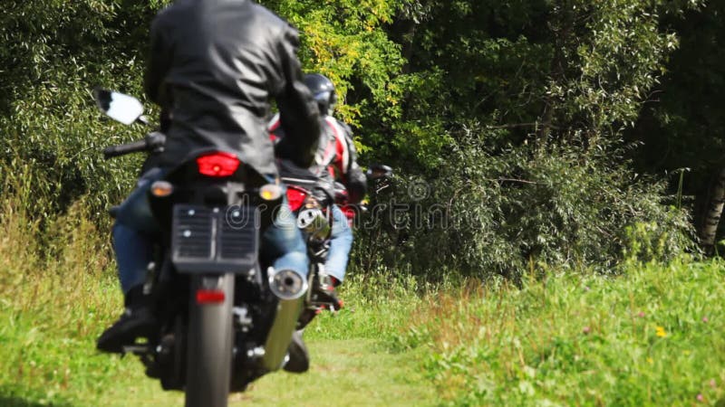 Two Bikers on Motorcycles Goes Forward on Footpath Stock Footage ...