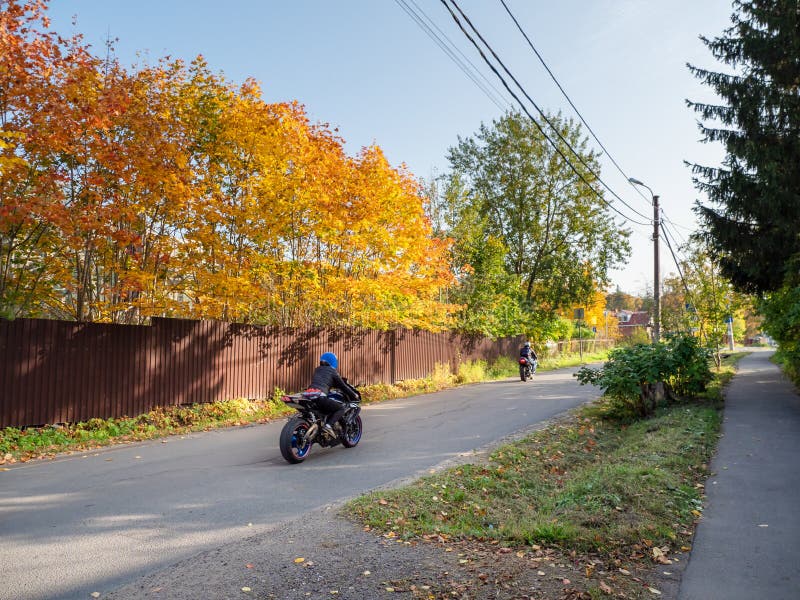Two Bikers on Motorcycles Ride on a Rural Autumn Road. Stock Image ...