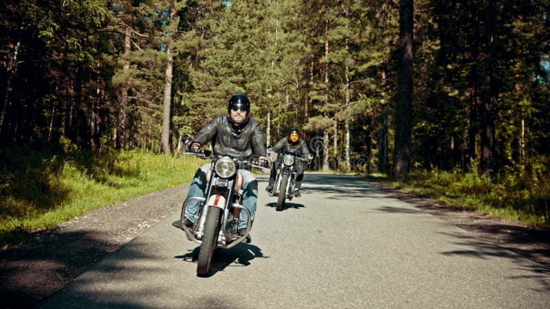 Two Bikers are on Their Bikes Riding Too Fast on the Road Stock Photo ...