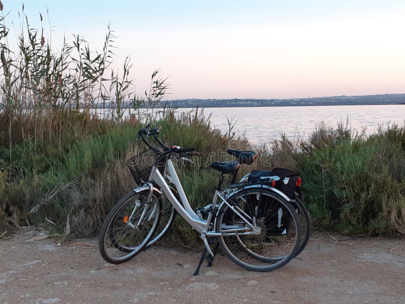 Two Bikes in the Background of the Lake Stock Photo - Image of ...