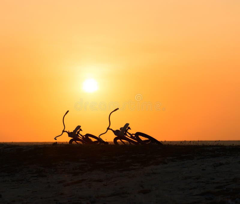 Two Bikes Silhouettes at the Tropical Sunset Stock Photo - Image of ...