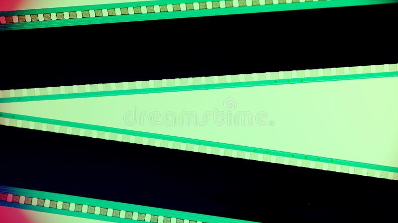 Two Black Film Strips on Green Background Close Up. 35mm Film Slide ...