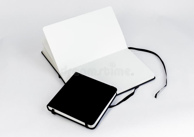 Two Black Notebooks. Small Closed Square Notepad and Large Open Unfold ... Two Black Notebooks. Small Closed Square Notepad and Large Open Unfold ...