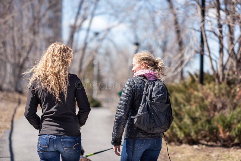 Two Blond Women Walking a Dog Stock Photo - Image of leisure, cute ...
