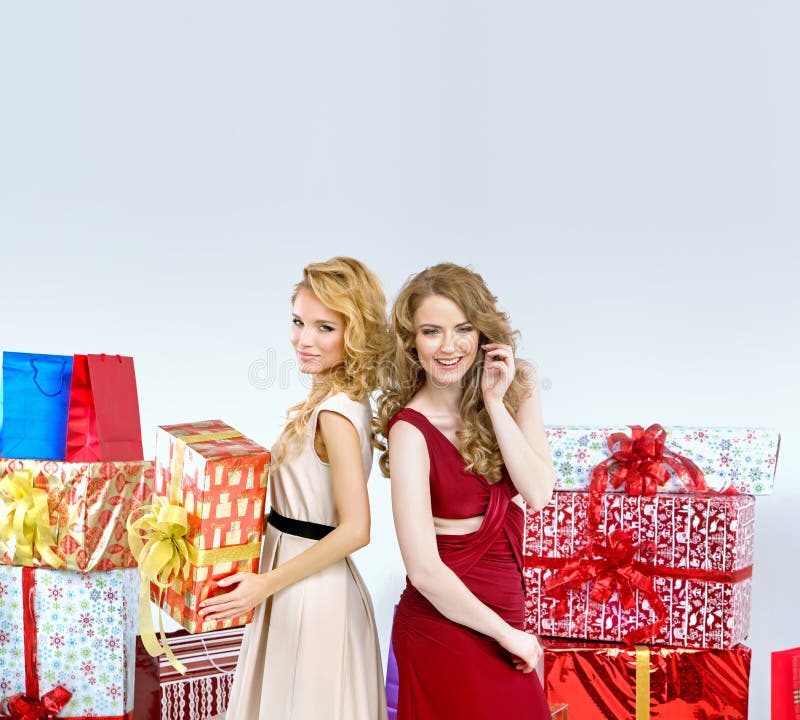 Two Blondies Holding Christmas Presents Stock Image - Image of ...