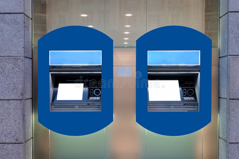 Two Blue ATM Machines with Empty White Screens on a Wall Outside Stock ...