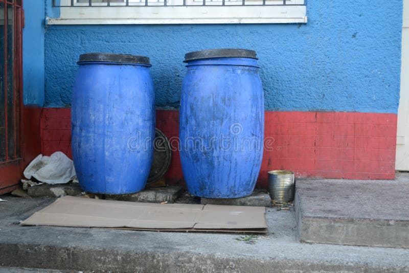Two Blue Barrels in Backyard Stock Photo - Image of plastic, deck: 24747506