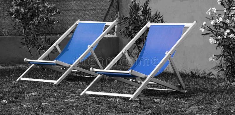 Blue Beach Lounges in a Grey Garden Stock Image - Image of beach ...