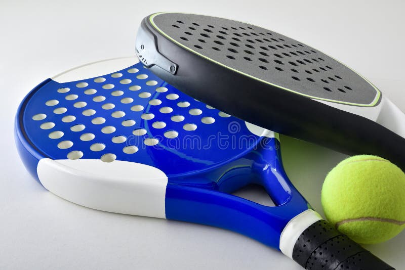 Two Blue and Black Paddle Rackets on White Table Stock Image - Image of ...