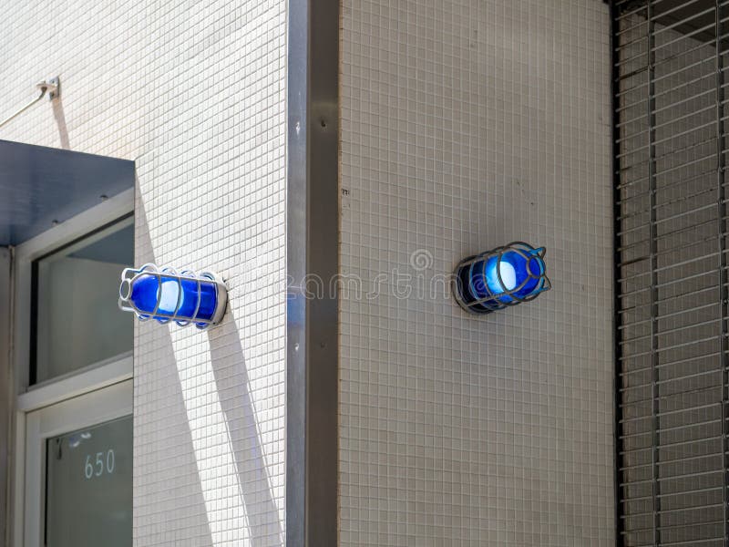Two Blue Caution Safety Lights on Corner of Building Outside Stock ...