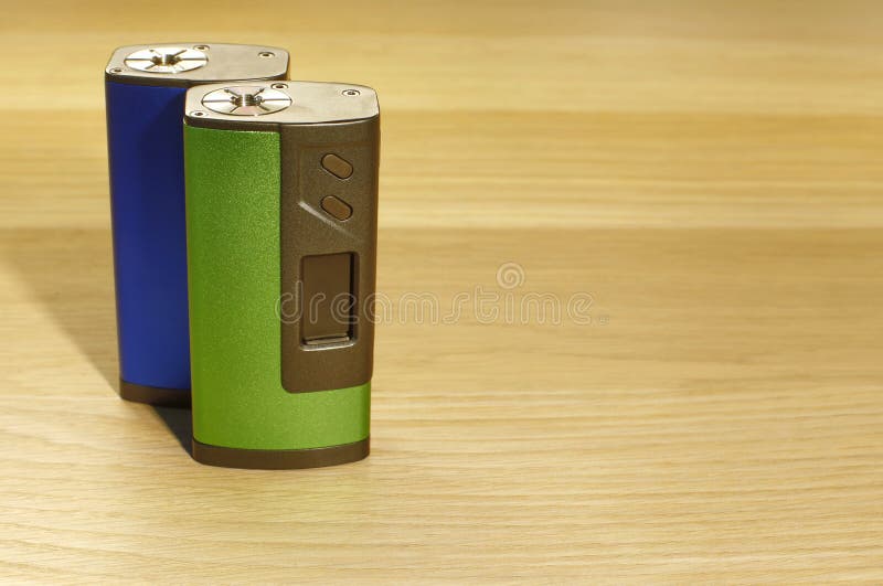 Two Blue and Green Boxmod Devices for Vaping Electronic Cigarette on ...