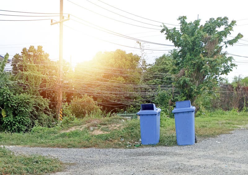 Two Blue Trash Cans Stand on the Side of the Road Stock Photo - Image ...
