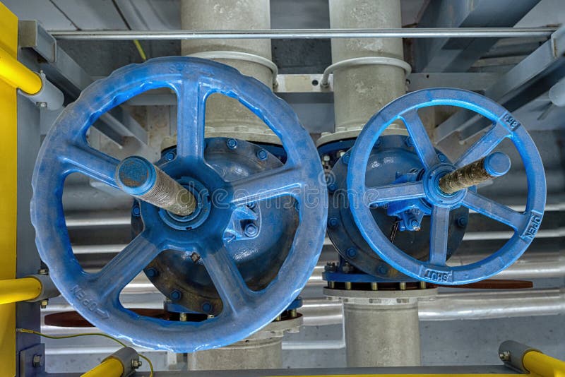 Two Blue Valves with Valve Control Wheel with Part of Pipeline in the ...