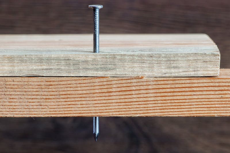 Two Boards Knocked Down with a Big Nail. Connection with the Help of ...