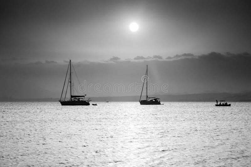 Two Boats and a Boat in the Middle of the Sea Stock Photo - Image of ...