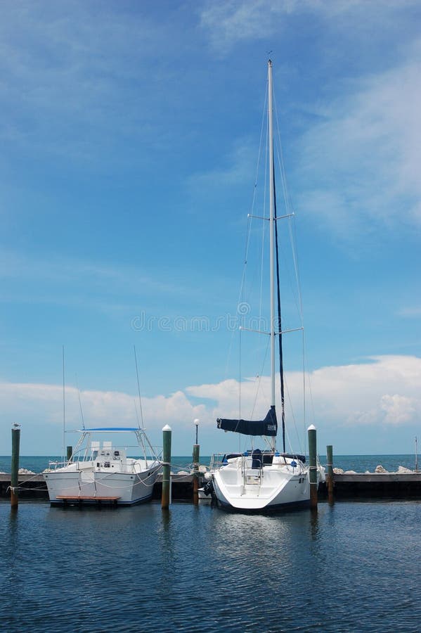 Two boats by dock stock photo. Image of retirement, florida - 238690
