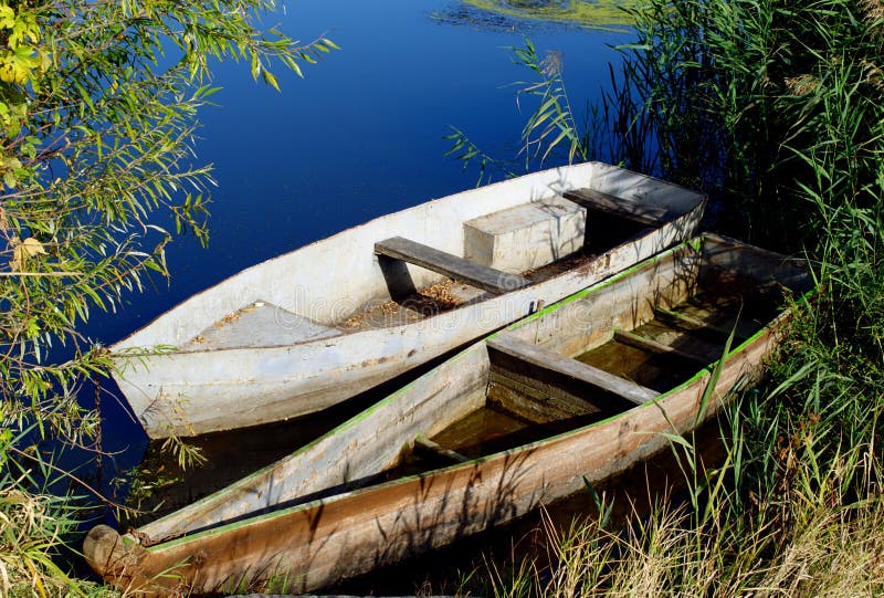 Two boats near the shore stock photo. Image of blue, vessel - 21378334