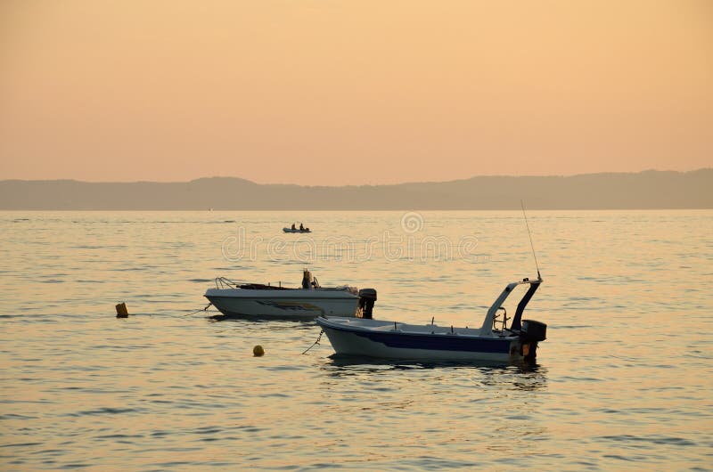 Two boats on sea in sunset stock photo. Image of seascape - 58662924