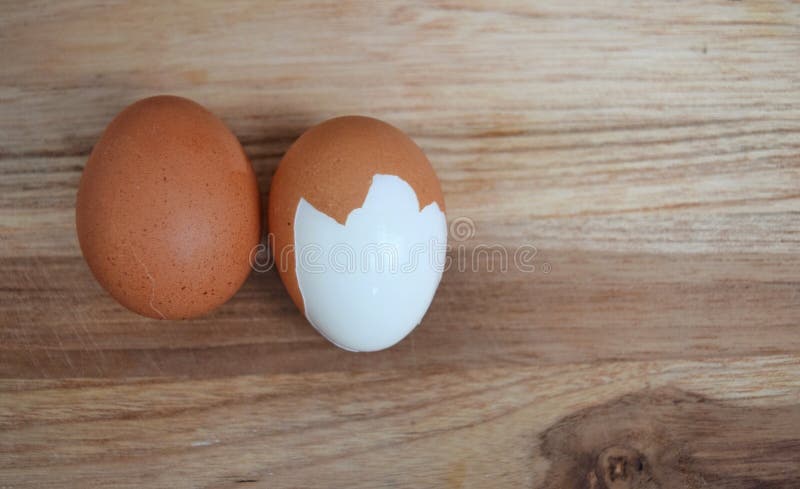 Two Boiled Eggs with Part of the Egg Shell Peeled Off Stock Image ...