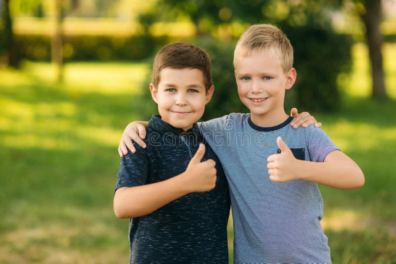 Two Bothers Spend Time in Park. they Have Fun and Some Relax Befour ...