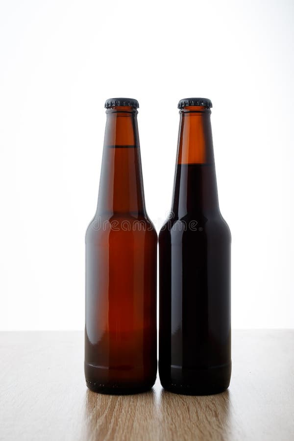 Two Bottles, Lager and Dark Beer. Wooden Table. Stock Image - Image of ...
