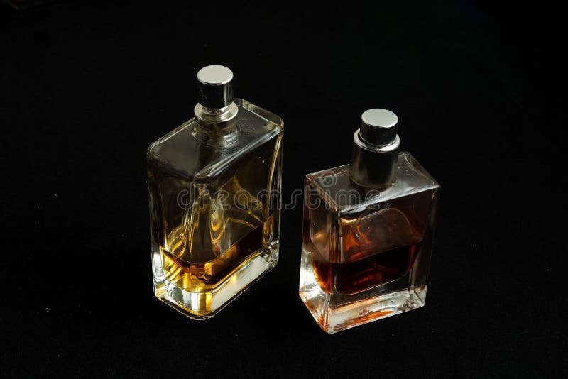 Two Bottles of Parfume of the Same Color and of a Different Size Stock ...