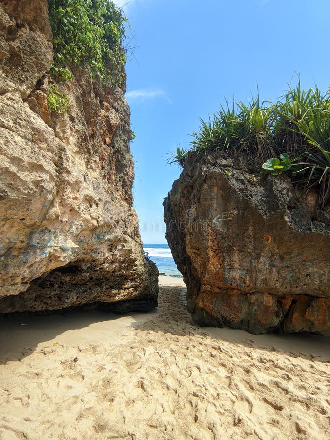 Two Boulders Lead To the Beach Stock Photo - Image of formation, cove ...